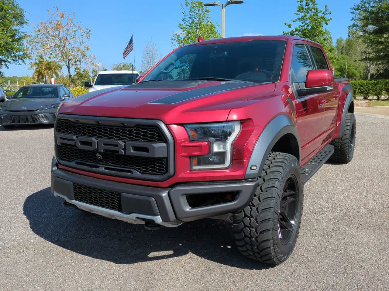 Red Ford Raptor Lifted